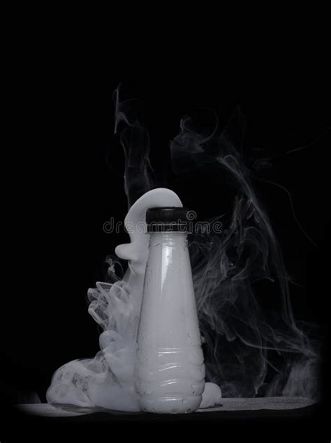 Plastic Bottle With Fog Spraying From Top Creating Strange Effects Shapes And Textures Stock