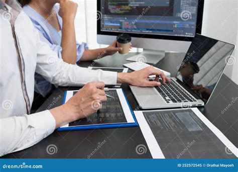 Team Of Programmers Working With Computer Programming Professional Development And Coding