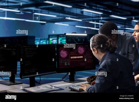 Multiethnic Team Of Developers In Server Hub Frightened By Hacker Passing Firewall And Stealing
