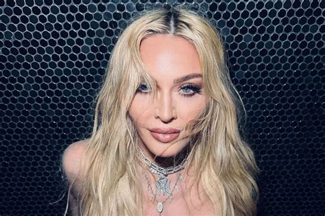 Madonna And Mystery Man Put On Steamy Display As He Touches Her Chest