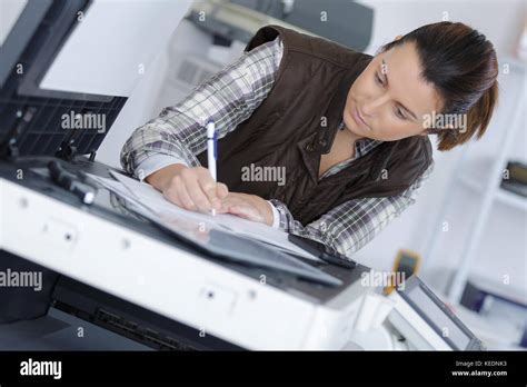 Female Writing A Report Stock Photo Alamy