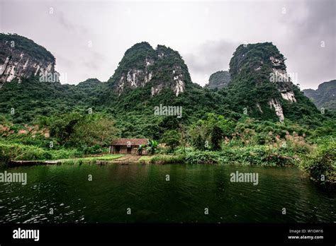 Boat Cave Tour In Trang An Scenic Landscape Formed By Karst Towers And