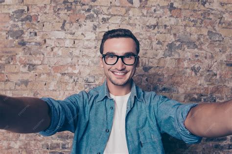 Premium Photo Handsome Cheerful Smiling Man In Glasses Making Selfie