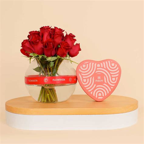 Patchi Tin Box Of 22 Pieces A Vase Of 20 Red Roses Alexandria