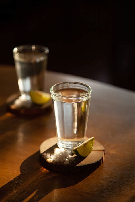 Download Tequila Shots On Wooden Coasters Wallpaper