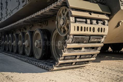 Military Tank Track On Sandy Terrain In Bright Daylight Showcasing