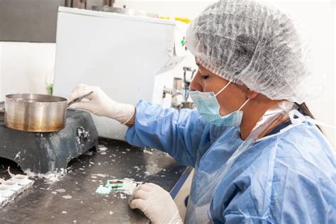 Scientist Embedding Tissues In Paraffin Blocks For Sectioning Pathology Laboratory Stock Image