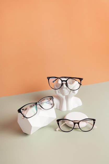 Premium Photo Gypsum Elements With Eyeglasses On Colored Background Optical Store Vision Test