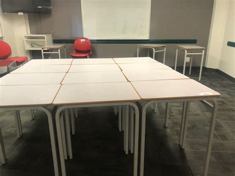 All Grey Metal Frame Student Desks In Classroom