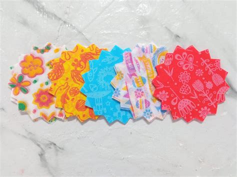 กระดาษสาห่อเหรียญโปรยทาน แบบปั๊มตัดขอบแล้ว แบบลาย