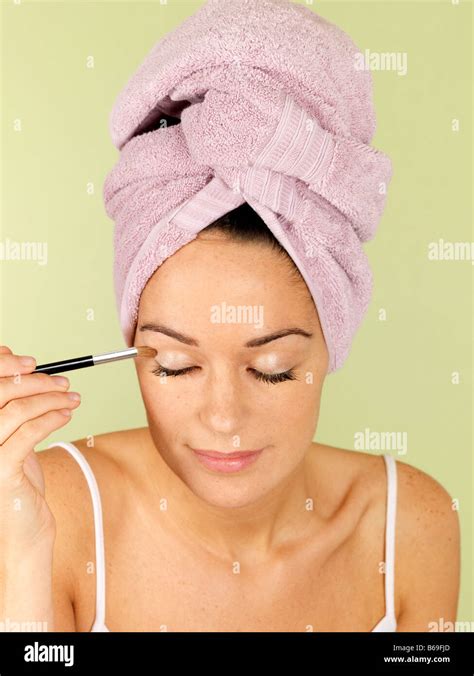 Young Woman Alone Applying Face Makeup Cosmetics Getting Ready To Go