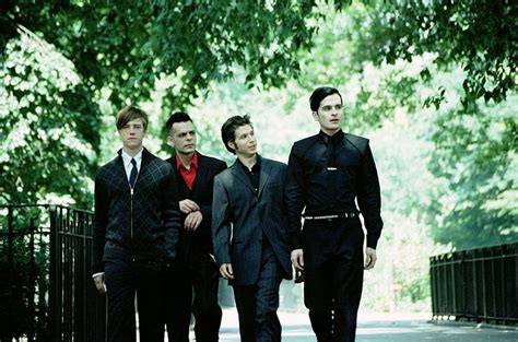 Rock Band Interpol Pose For A Portrait Shoot For The Intersection Artofit