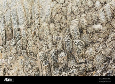 Natural Background Rock Texture From Weathered Columnar Basalt Stock