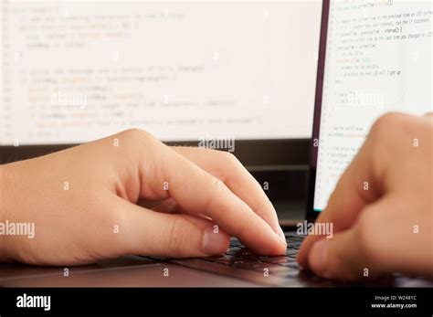 programmer making code hands touching keyboard on digital screen