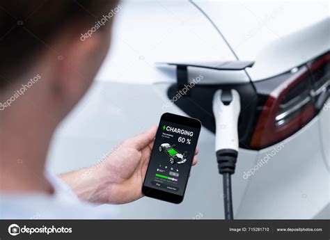 Modern Eco Friendly Man Recharging Electric Vehicle Charging Station