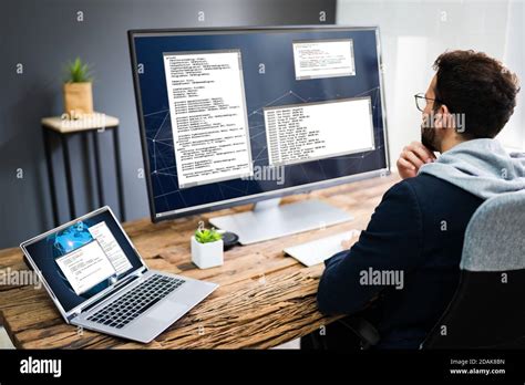 Software Developer Programmer Using Computer In Work From Office Stock