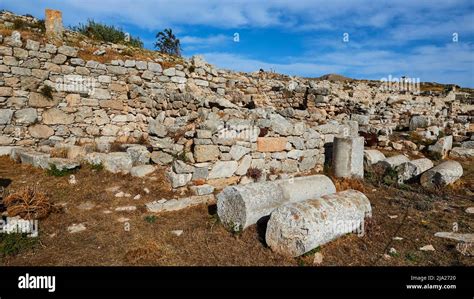 Ancient Wall Reclining Columns Blue Sky White Clouds Old Thera