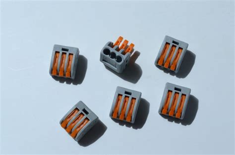 Premium Photo Clamping Terminal Blocks Lie On A Light Background Close Up