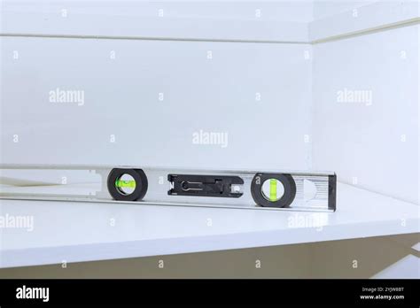 Construction Level Is Placed On Newly Shelf Aiding In Accurately Checking Horizontal Alignment