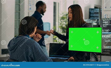 Asian It Engineers Analyzing Greenscreen On Computer And Coding