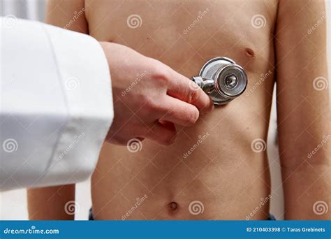 Pediatrician Listens To A Patient With A Stethoscope Auscultation Of