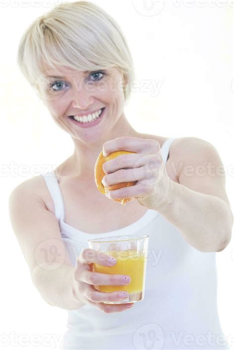 Young woman squeeze orange juice 31061364 Stock Photo at Vecteezy