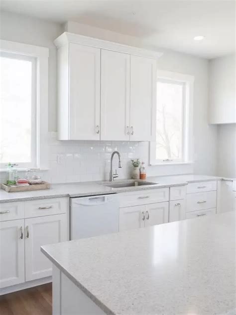 Modern Kitchen With White Cabinets And Thin Edge Light Gray Quartz