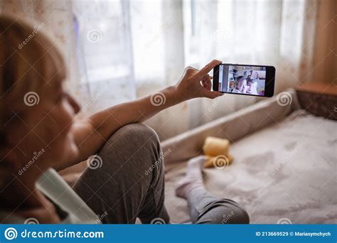 Cute Girl Talking With Her Grandmother Within Video Chat On Laptop