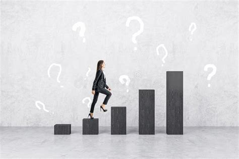 Businesswoman Climbing Conceptual Blocks Among Question Marks Stock