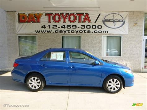 2010 Blue Streak Metallic Toyota Corolla Le 82672632 Photo 7