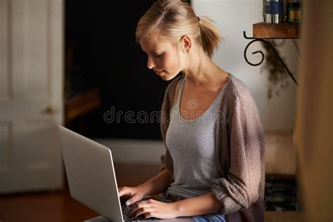 Woman Freelancer And Laptop For Networking Remote Work And Internet Connection In Kitchen For