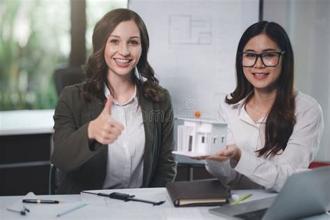 Construction Concept Of Engineer And Architect Working With Construction Model And Blueprint