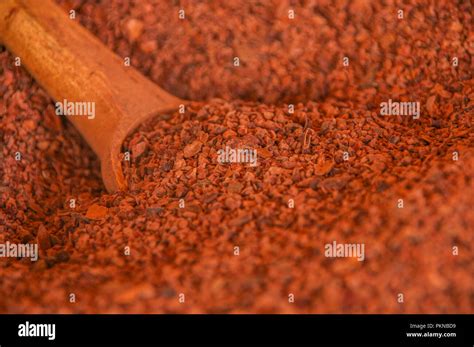 Close Up Of Wooden Spoon With Dry Caco Beans In An Exposition Inside
