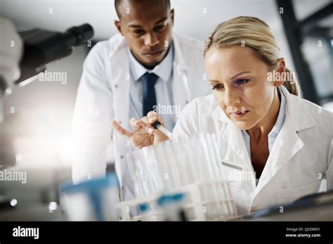 What They Do Saves Lives Cropped Shot Of Two Scientists Testing A