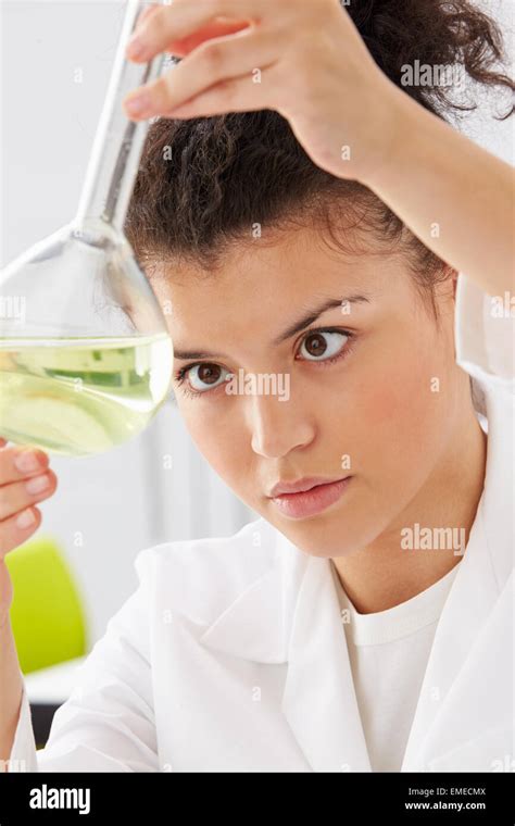 Female Scientist Studying Liquid In Flask Stock Photo Alamy