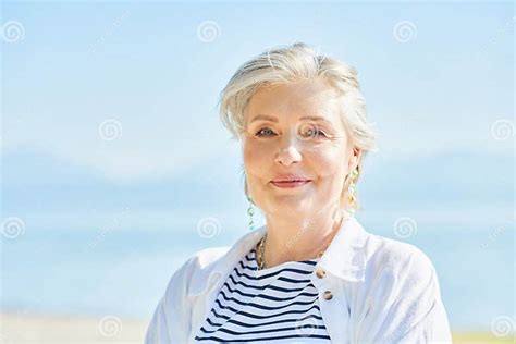 Outdoor Portrait Of Happy And Healthy Mature 50 55 Year Old Woman