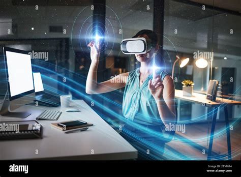 Metaverse, vr and business woman in virtual reality exploring a cyber world in office at night ...