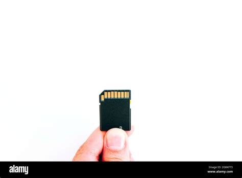 Male Hand Holding Sd Memory Card Isolated On White Background Stock Photo Alamy