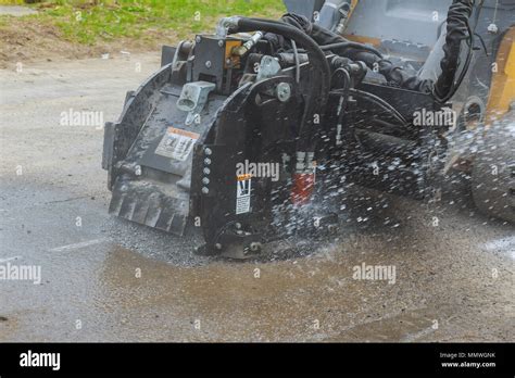 Road Construction Machine Breaks Up Asphalt Milling Machine Working On