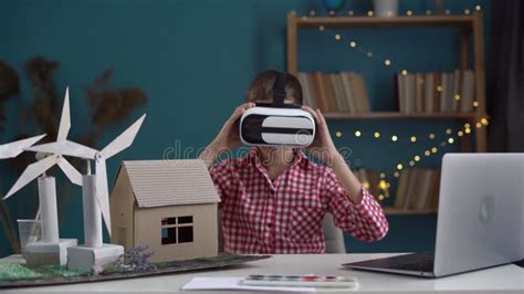 Schoolgirl Wearing Augmented Reality Headset Work With 3d Green Building High Tech Home Use