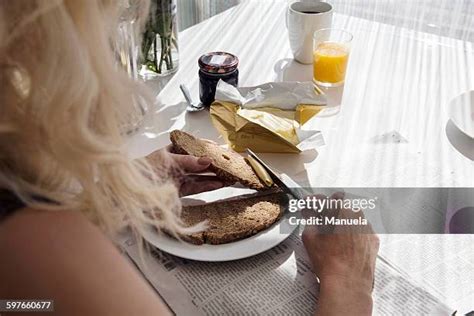 Woman Buttering Bread Photos And Premium High Res Pictures Getty Images