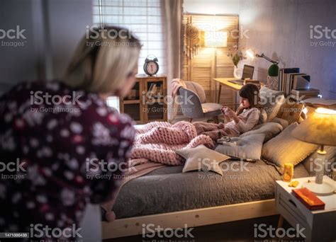 Mom Spying On Her Daughter While She Is Using The Phone In Bedroom