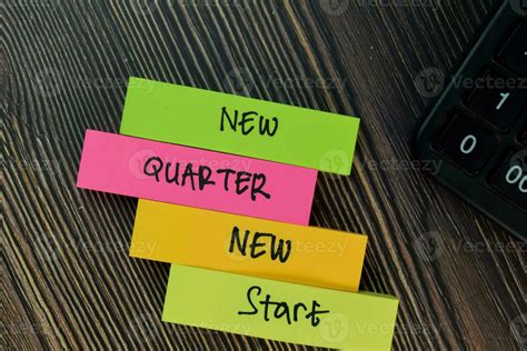 New Quarter New Start Write On Sticky Note Isolated On Wooden Table
