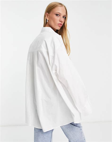 Белая рубашка оверсайз с широкими манжетами ASOS DESIGN – заказать из ...