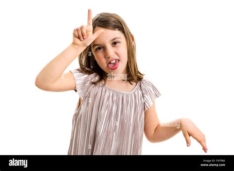Portrait Of Happy Girl Making Loser Hand Gesture At Camera Portrait Of