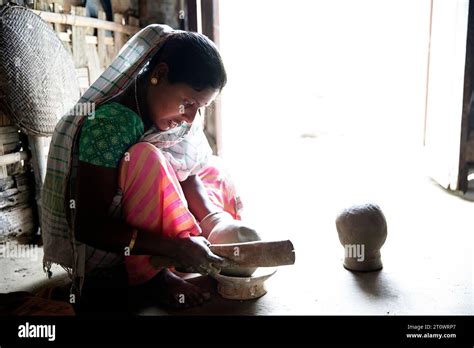 Woman In Traditional Indian Clothes Making Pottery In His Wooden House