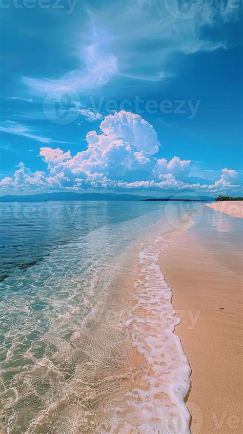 Sandy Beach With Clear Blue Water Under A Cloudy Sky 47988814 Stock