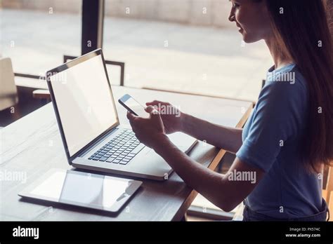 Close Up Multitasking Woman Using Tablet Laptop And Cellphone With Blank Screens Indoors On A