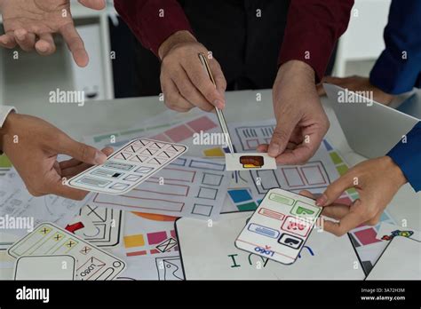 Creative Teamwork In Ux Ui Design Designers Engaging In A Lively Discussion Over Digital