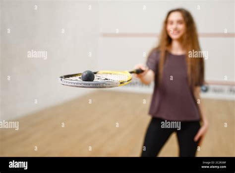 Female Person Shows Squash Racket And Ball Girl On Game Training Active Sport Hobby On Court